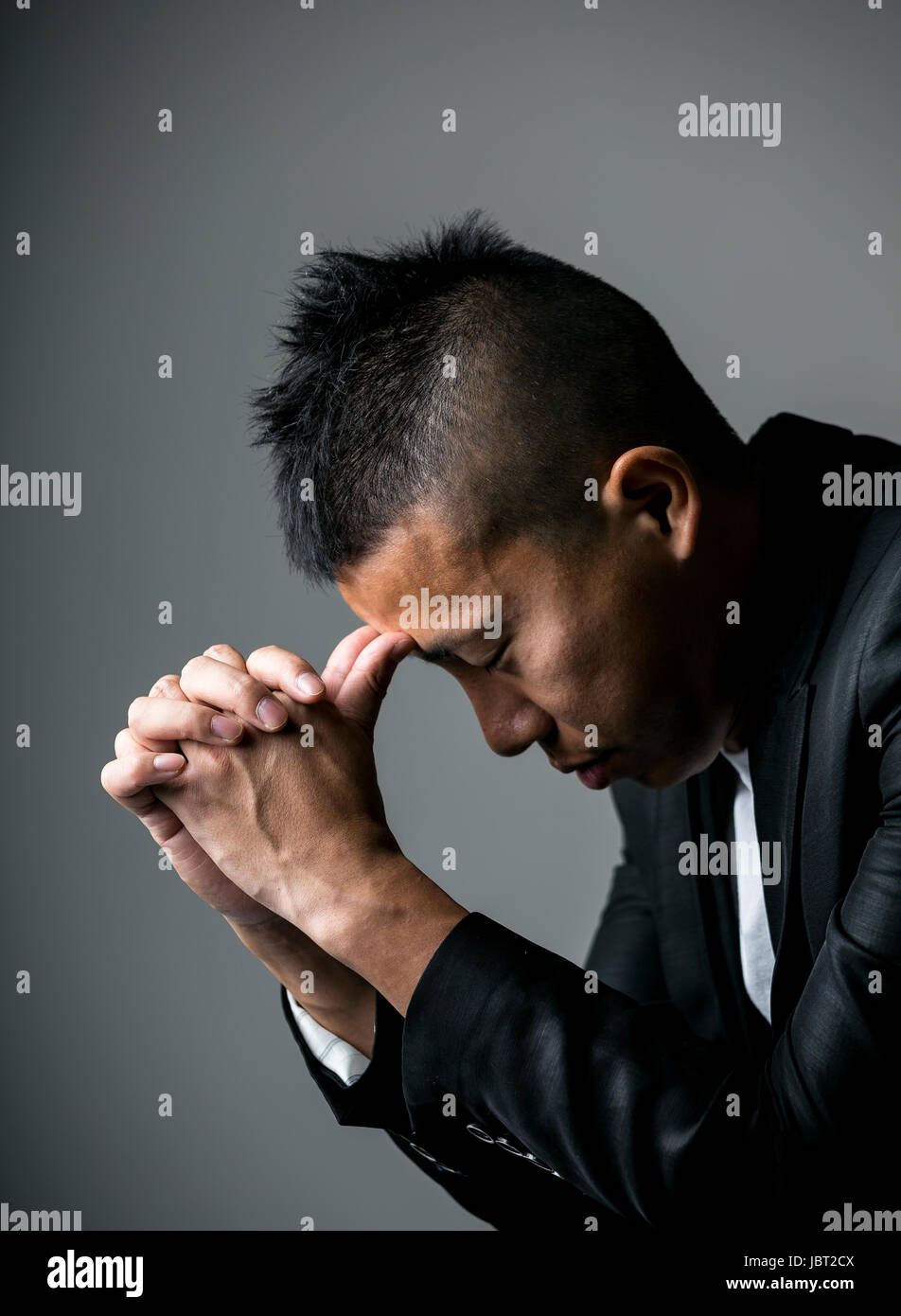Man thinking seriously Stock Photo - Alamy