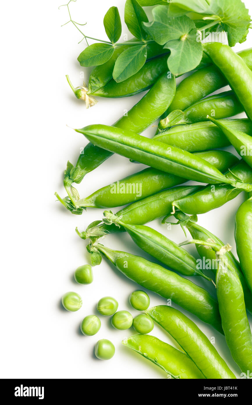 green pea pods on white background Stock Photo - Alamy