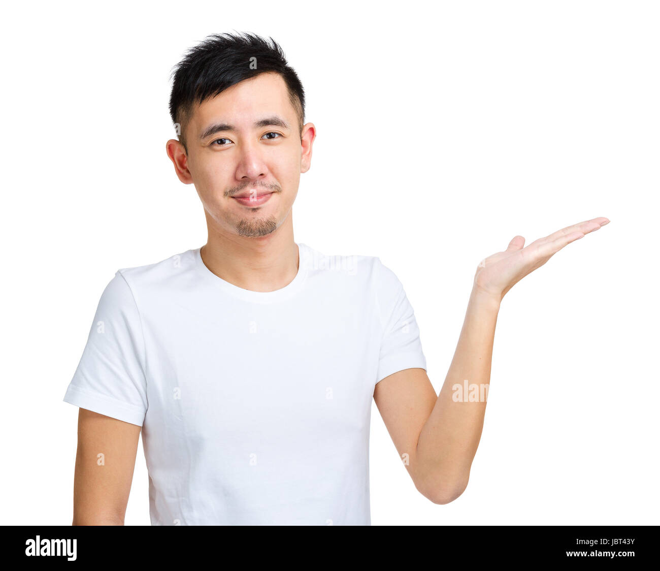 Young man with hand showing something Stock Photo - Alamy