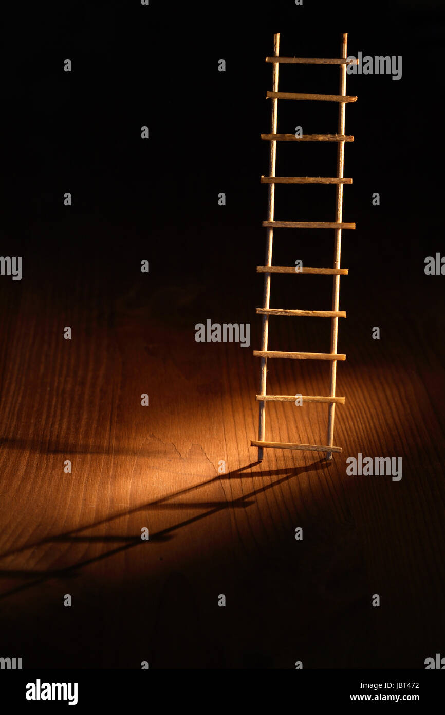 Escape abstract. Wooden ladder with shadow on dark background Stock ...