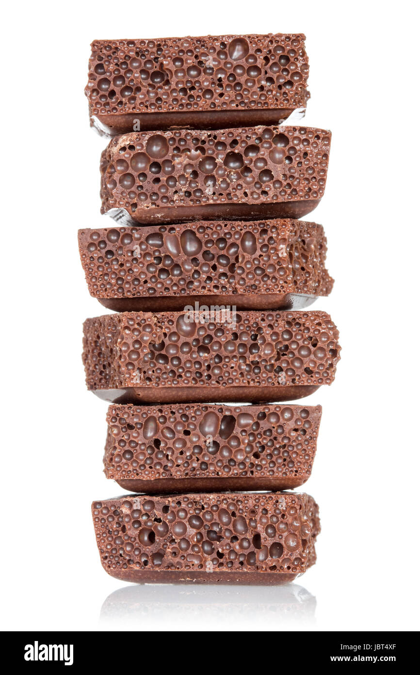 Stack of chocolate pieces on a white background Stock Photo - Alamy