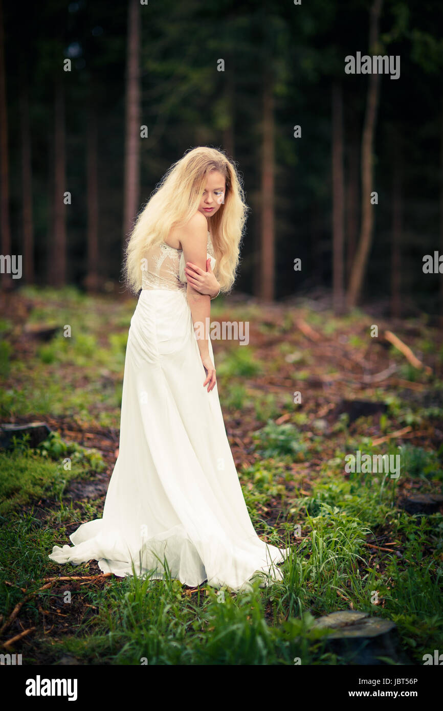 Lovely bride outdoors in a forest Stock Photo - Alamy