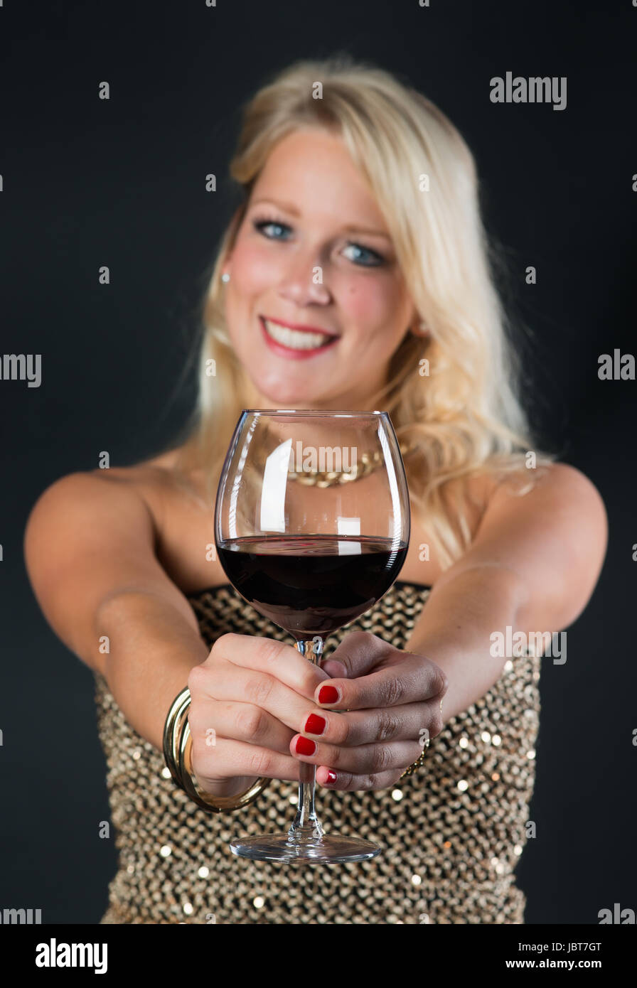 elegant woman with red wine in glass Stock Photo - Alamy