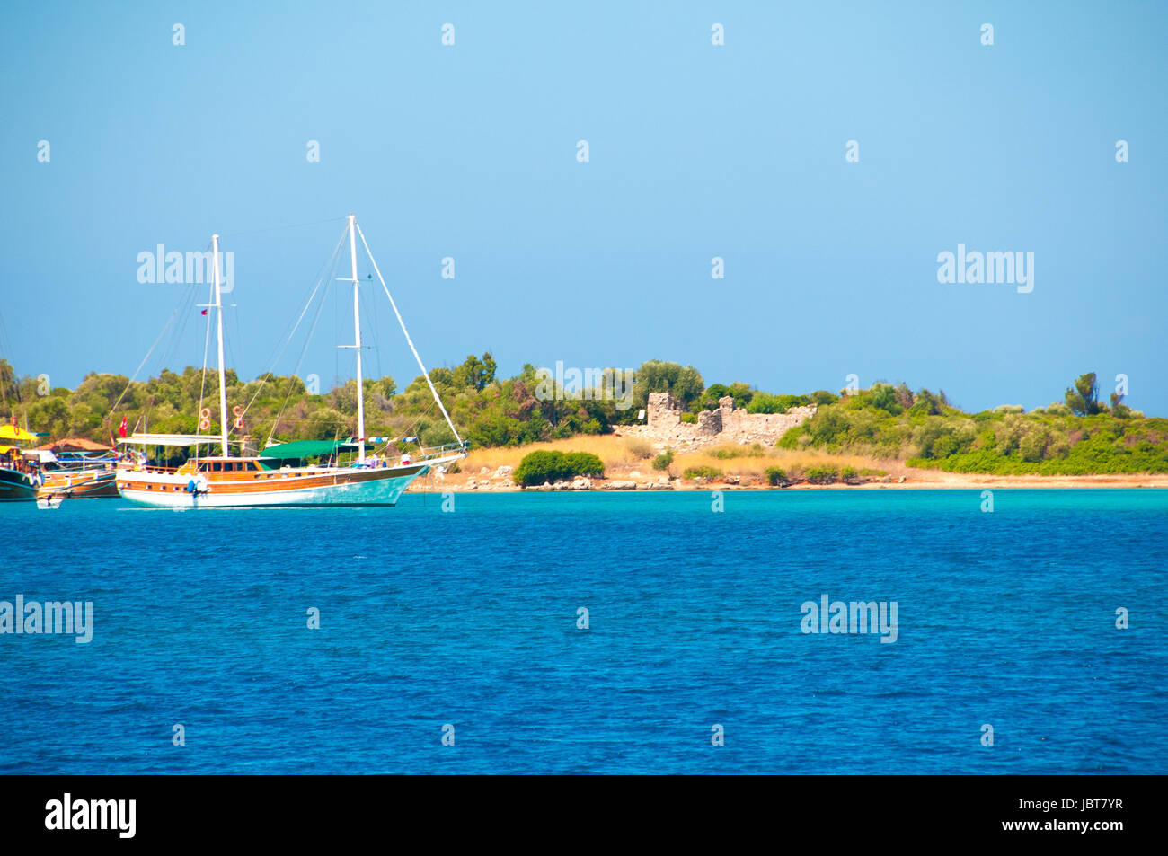 A ship with the sails down on the sea horizon Stock Photo - Alamy