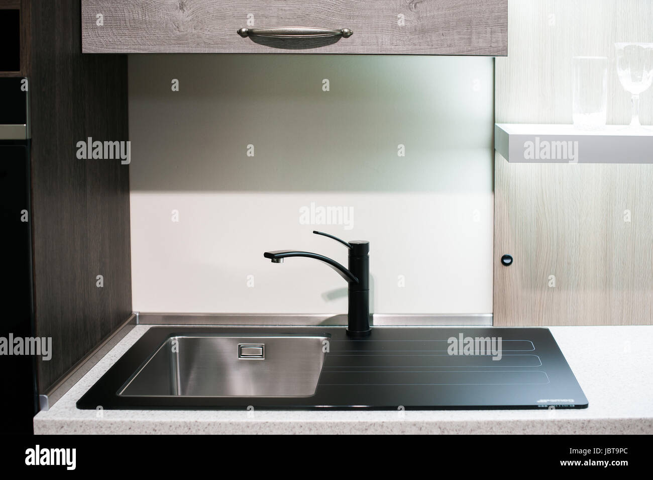 Angle view of kitchen sink with silver faucet Stock Photo - Alamy