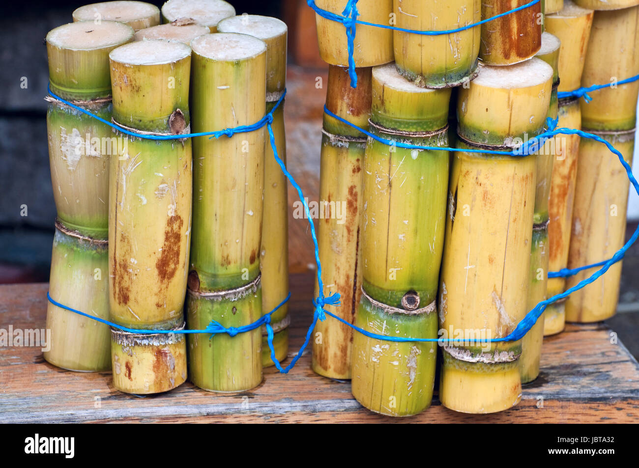 A close up photo of a stack of sugar cane sticks Stock Photo - Alamy
