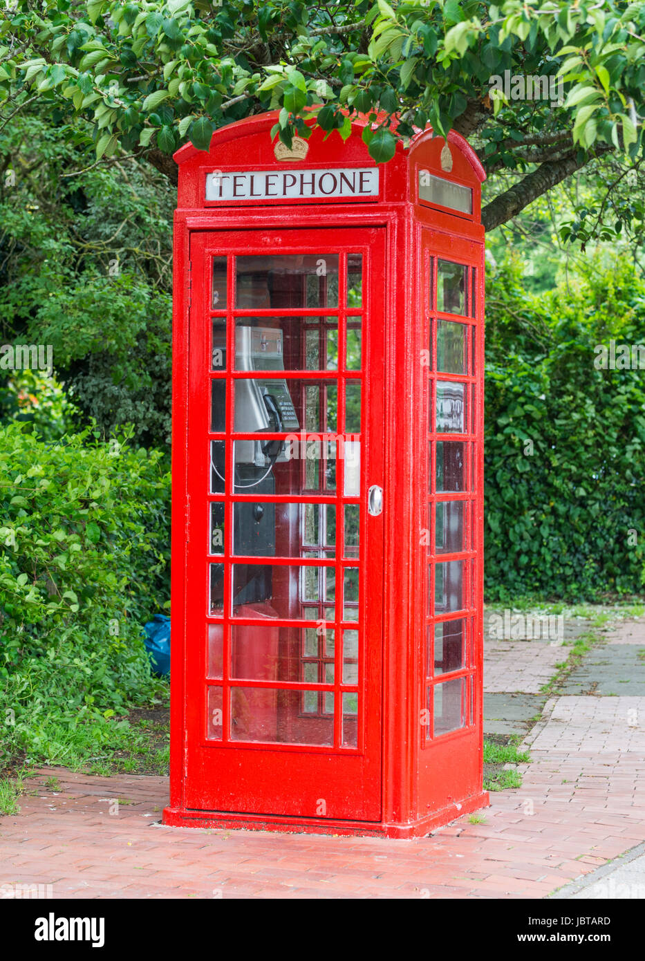 Freshly painted old British Telecom red K6 model telephone box in the ...