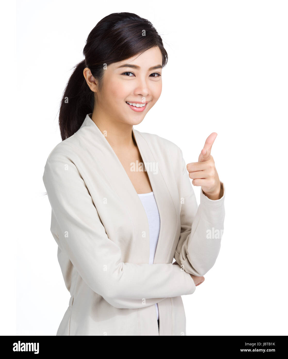 Young woman point to front Stock Photo - Alamy
