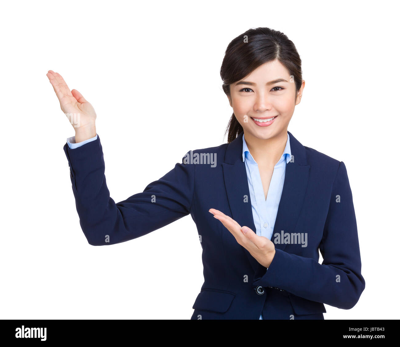 Young businesswoman presenting by hand Stock Photo - Alamy