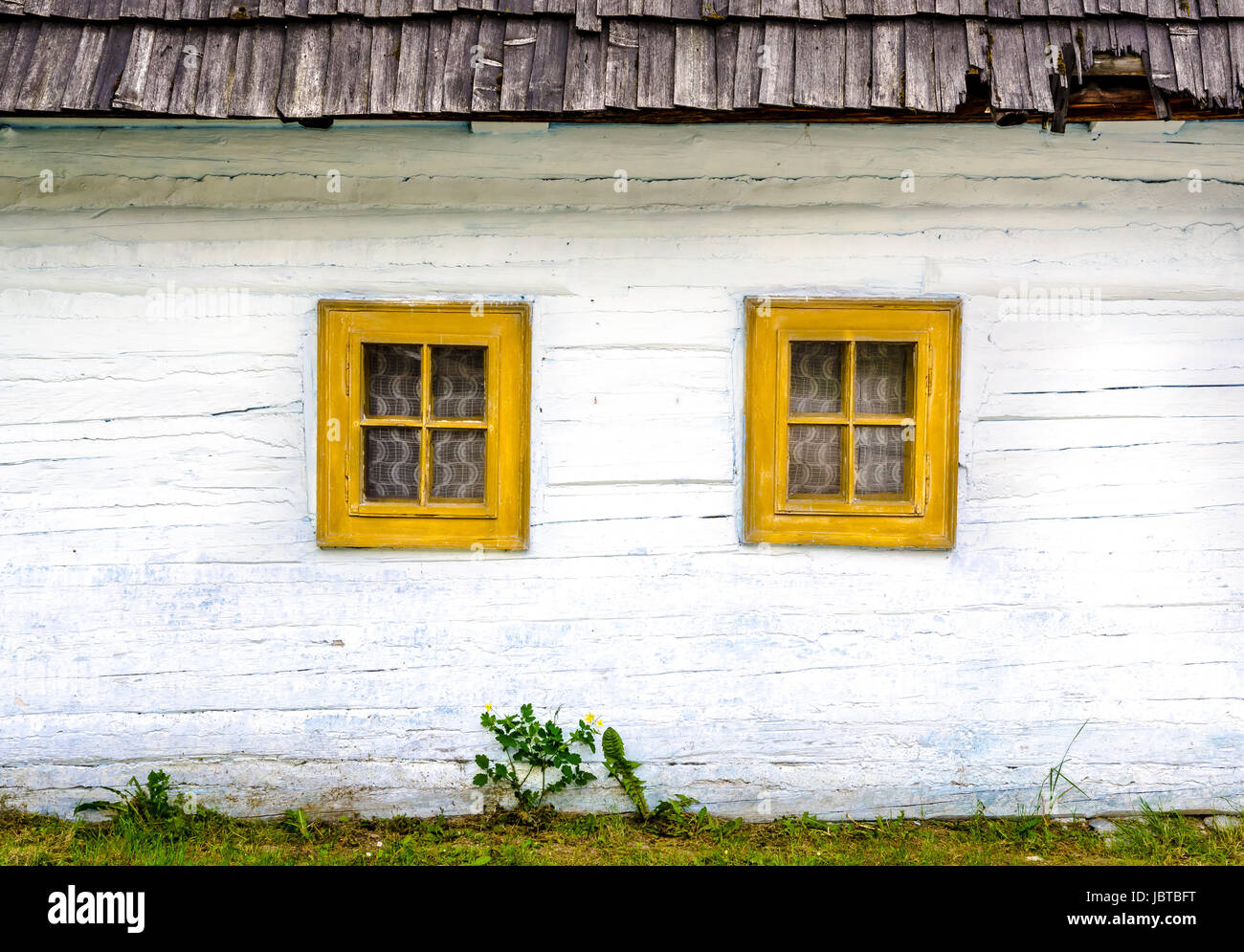 Detail of colorful windows on old traditional house, Vlkolinec village ...