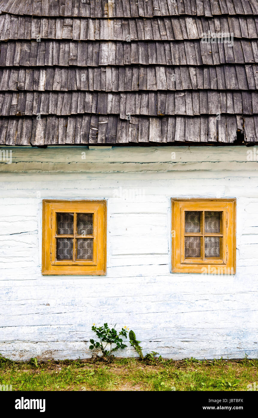 Detail of colorful windows on old traditional house, Vlkolinec village ...