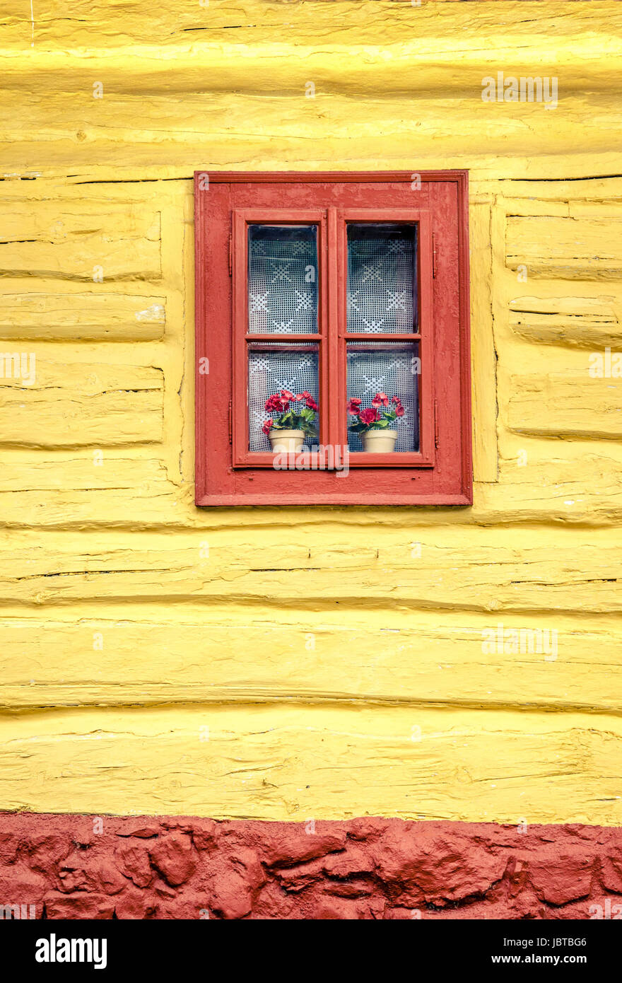 Close-up detail of colorful window on wooden traditional house ...