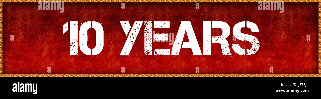Distressed font text 10 YEARS on red grunge board background ...