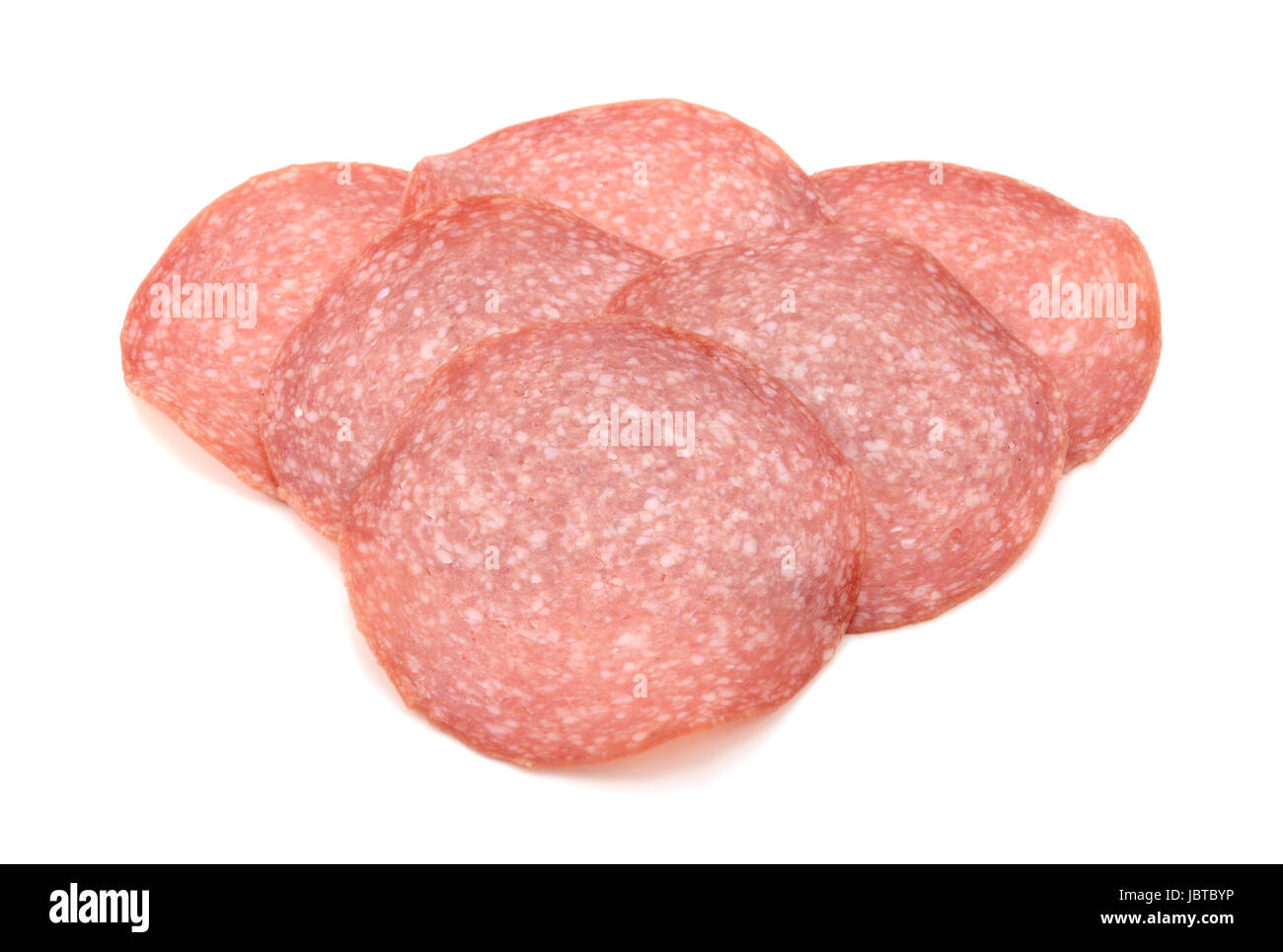Six German salami slices arranged in a triangle, isolated on a white ...
