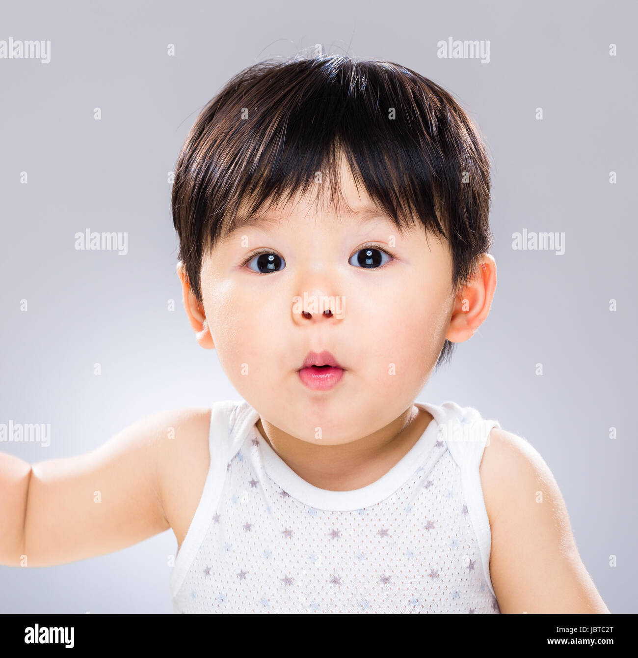 Baby boy feeling surprise Stock Photo - Alamy