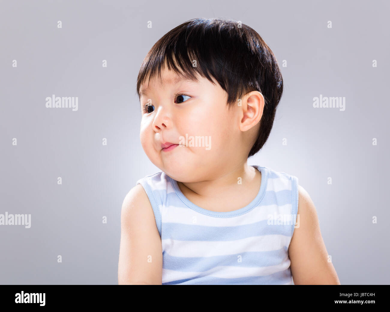 Little boy looking another side Stock Photo - Alamy