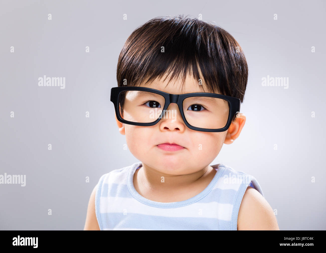 Little boy wearing spectacles Stock Photo - Alamy