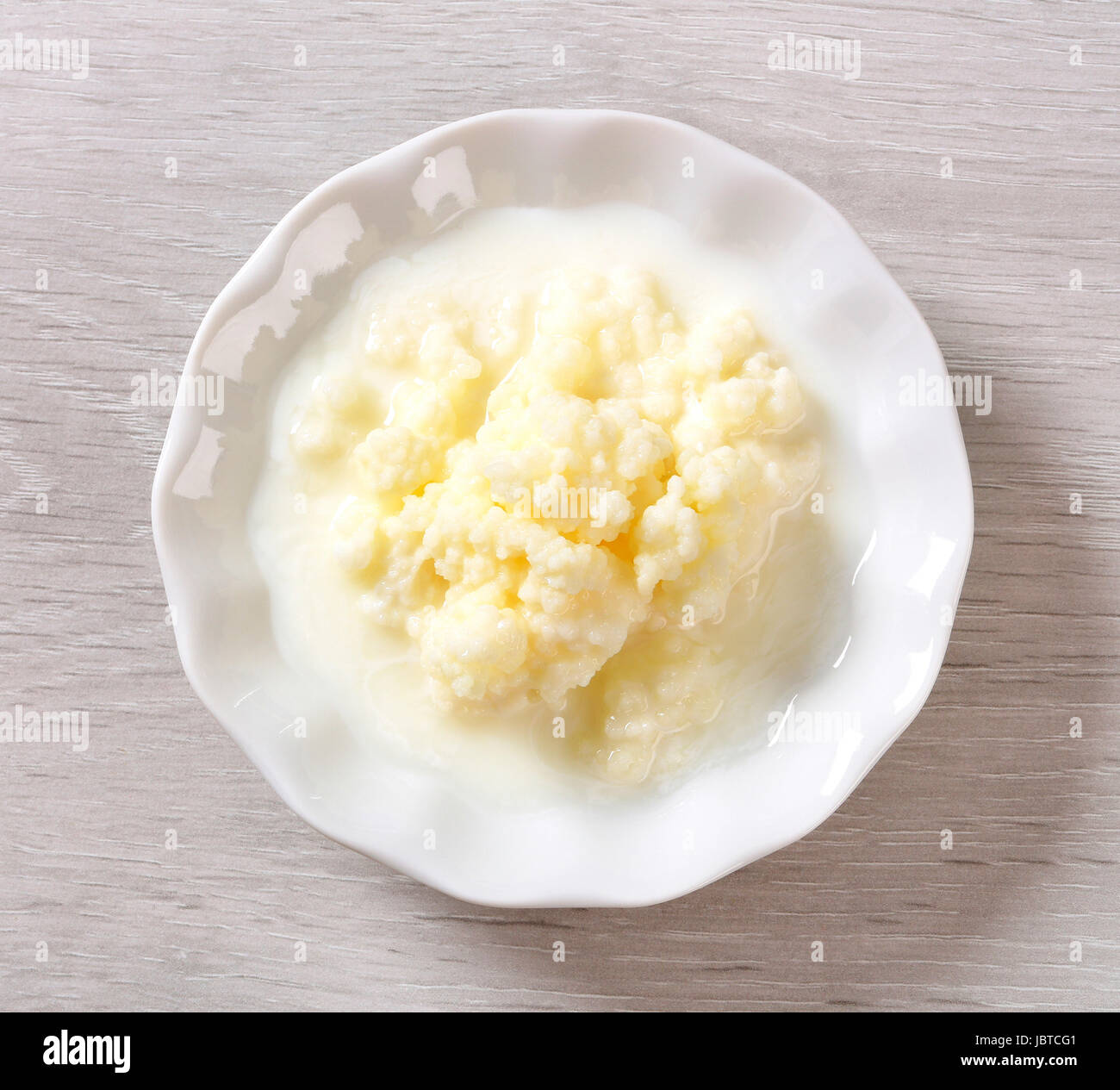 Organic probiotic milk kefir grains Stock Photo - Alamy