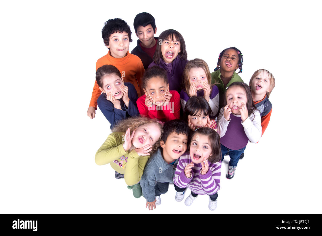 Group of children making funny faces isolated in white Stock Photo - Alamy