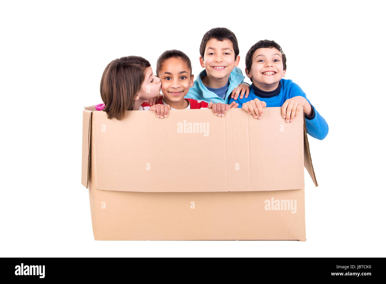 Happy kids inside a cardboard box isolated in white Stock Photo - Alamy