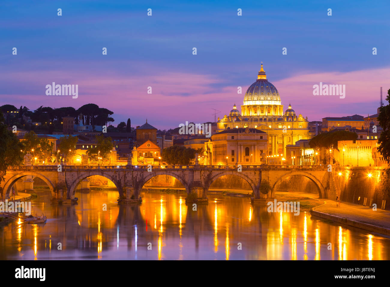 Night view of old roman Bridge of Hadrian and St. Peter's cathedral in ...