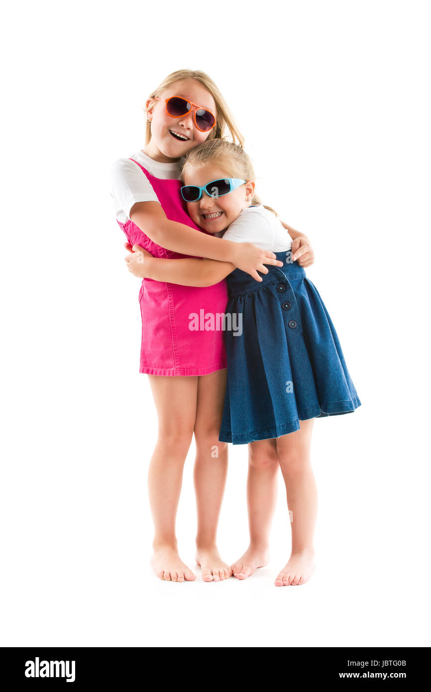 two happy little sisters isolated on white Stock Photo - Alamy