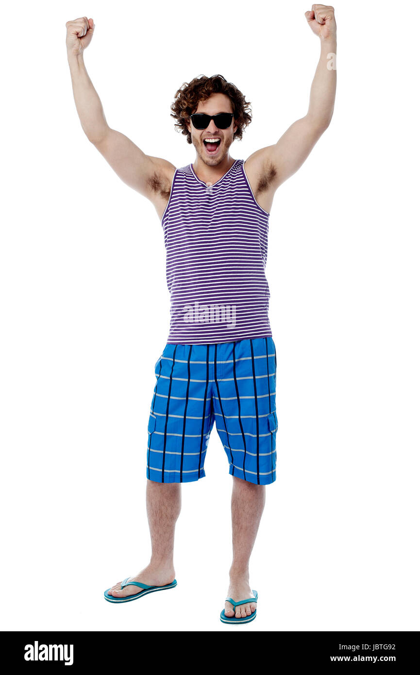Young guy raising his hand in excitement Stock Photo - Alamy