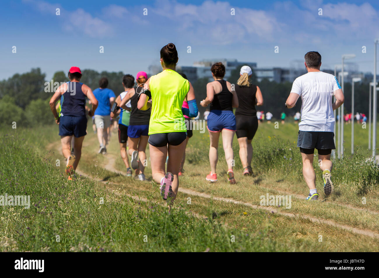 Outdoor cross-country running, Group of active people running in nature ...