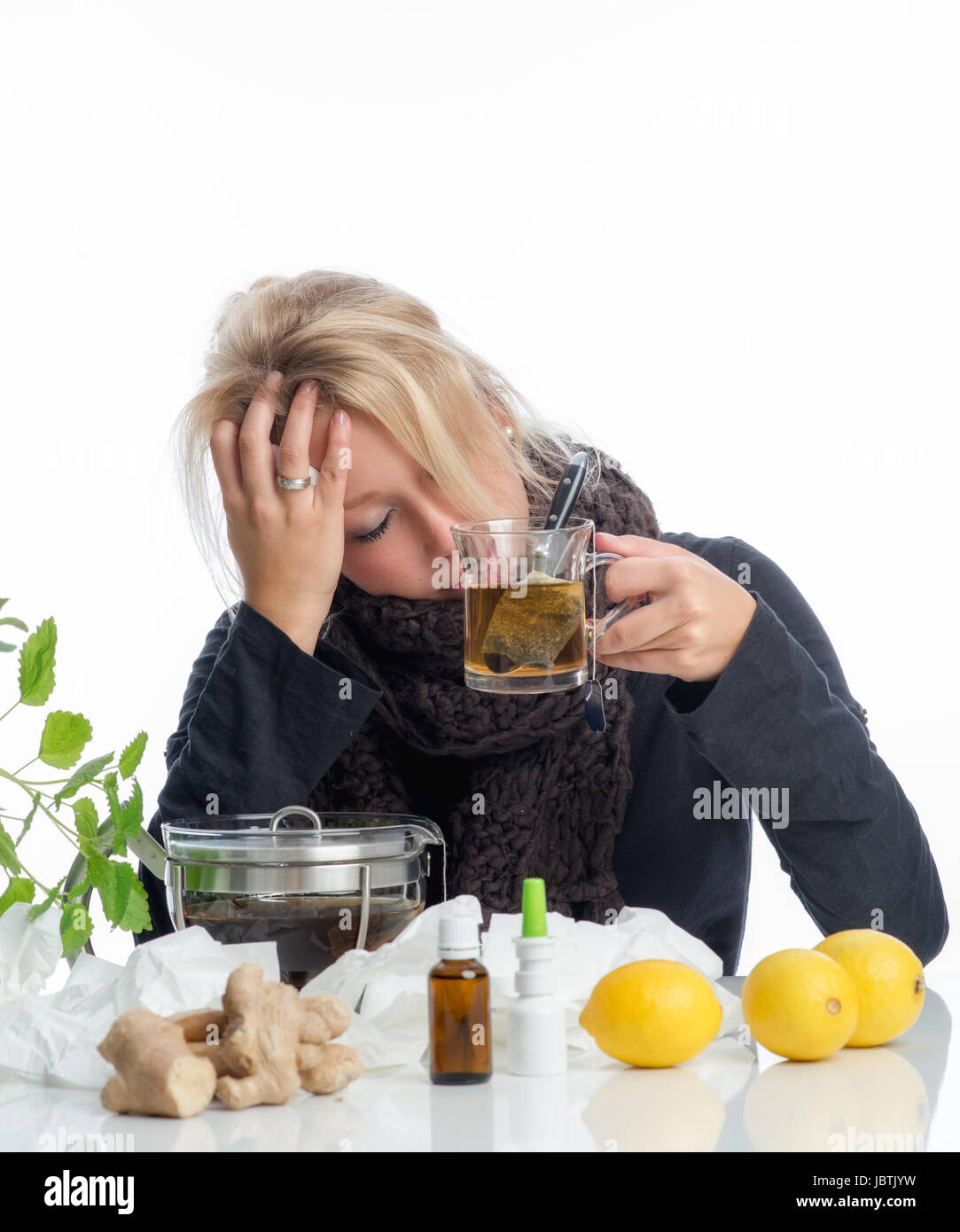 sick blond woman with remedies Stock Photo - Alamy