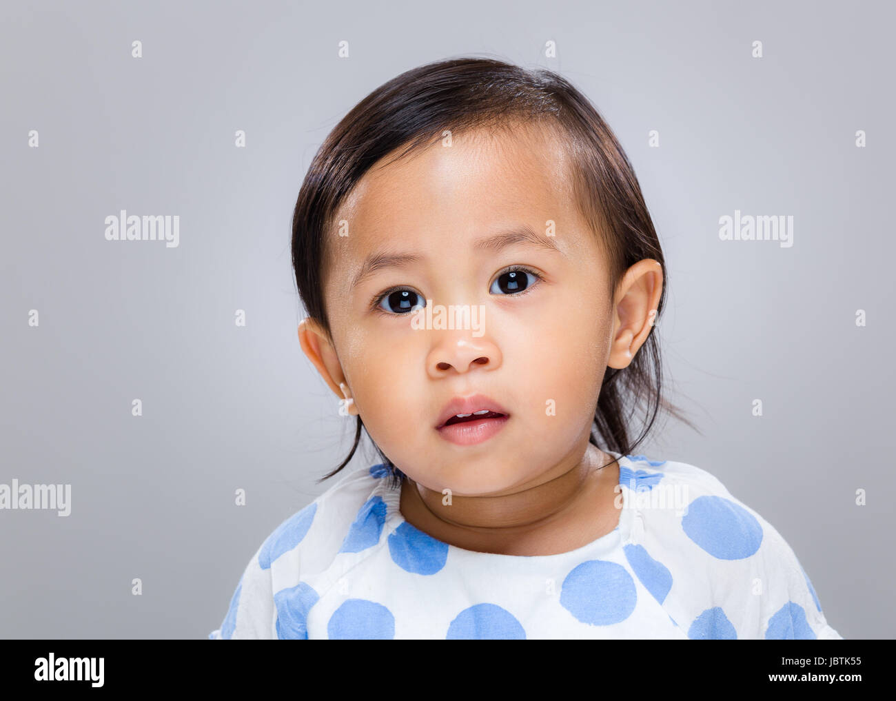 Confused baby girl Stock Photo - Alamy