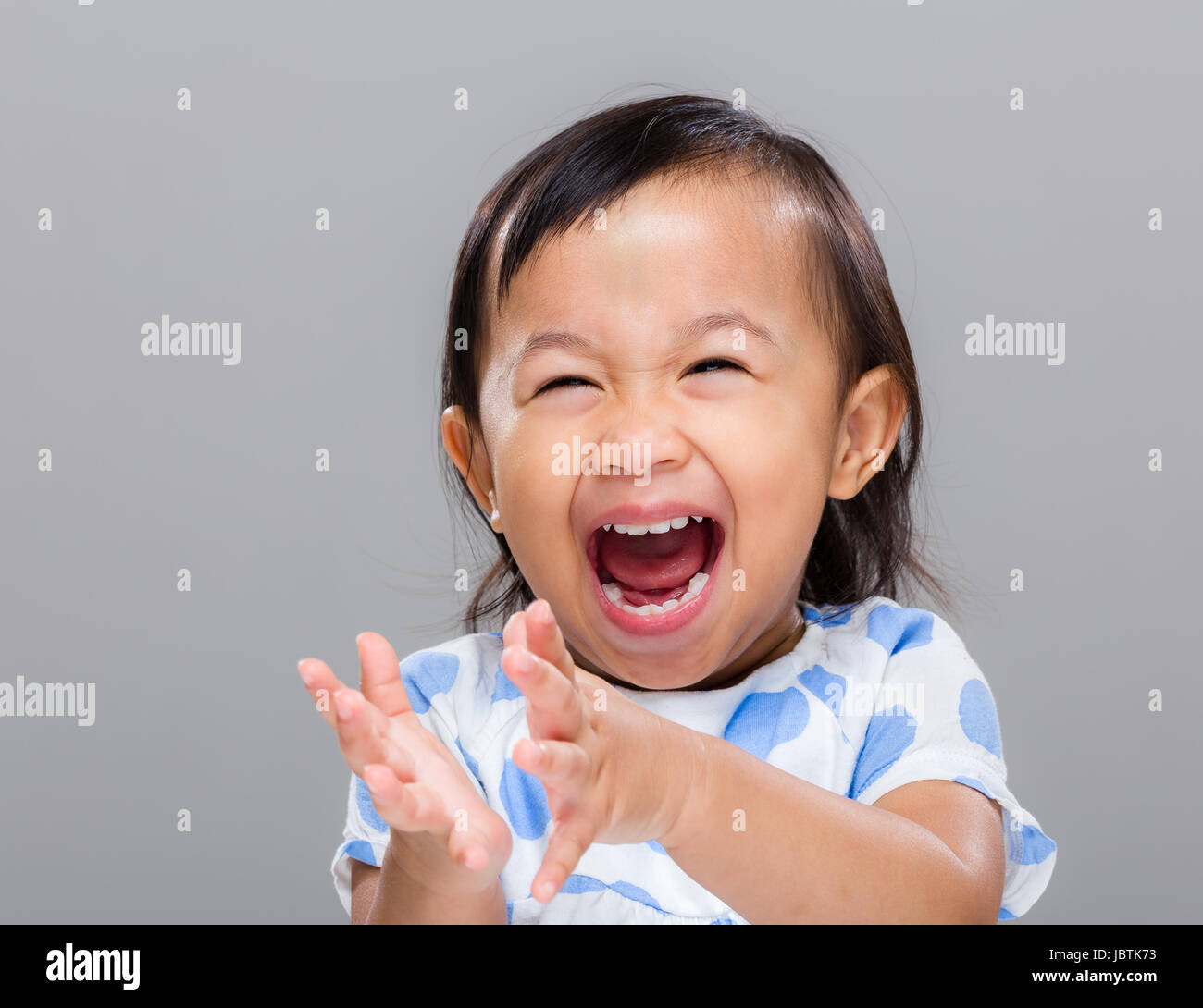 Happy girl clap hand Stock Photo - Alamy