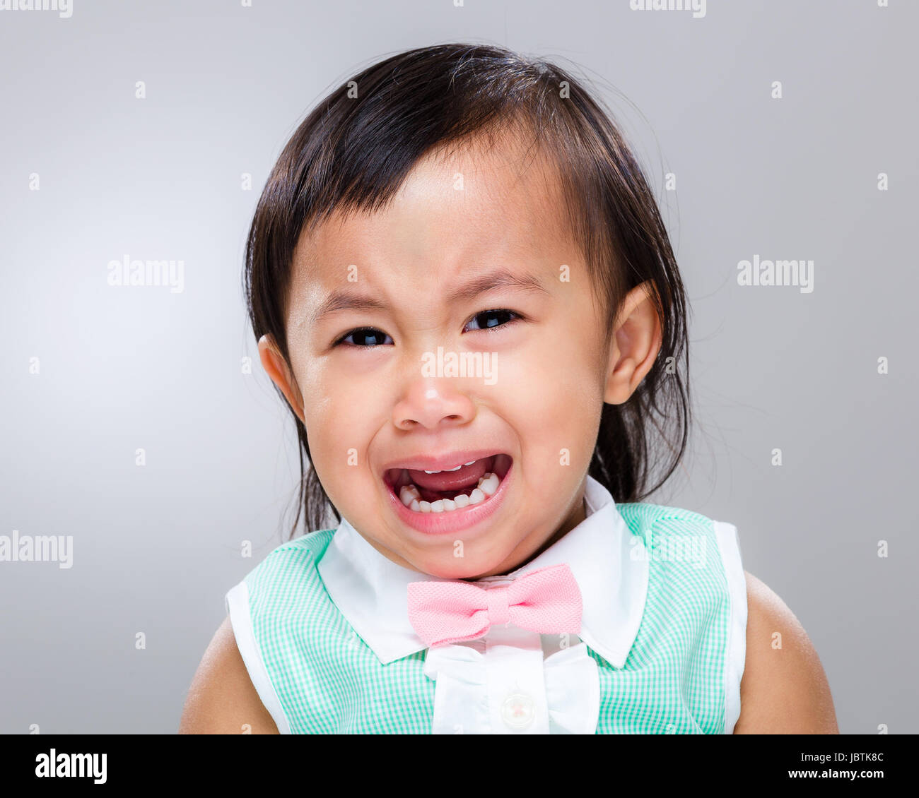 Two baby cry smile hi-res stock photography and images - Alamy