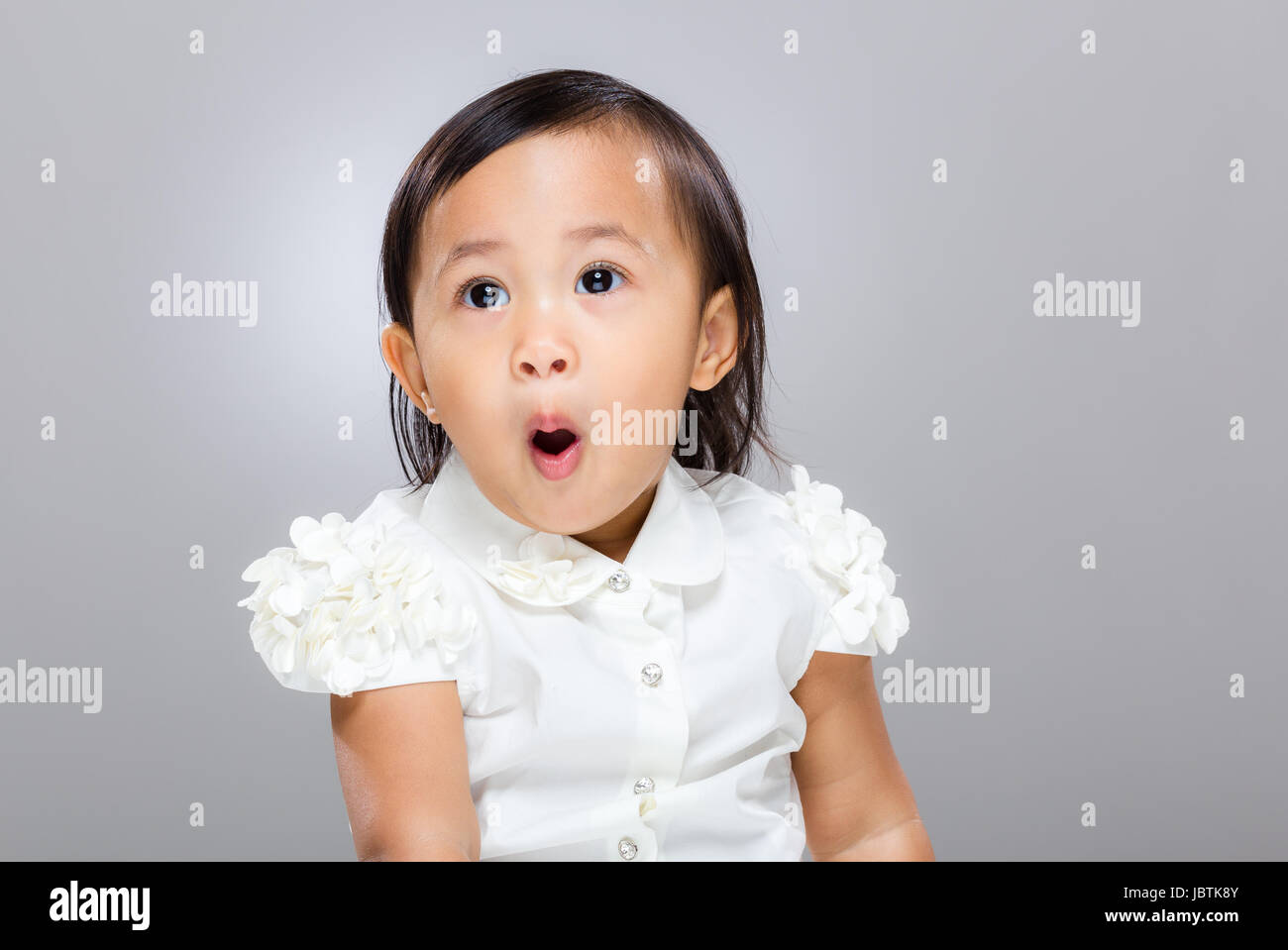 Little girl feel surprise Stock Photo - Alamy