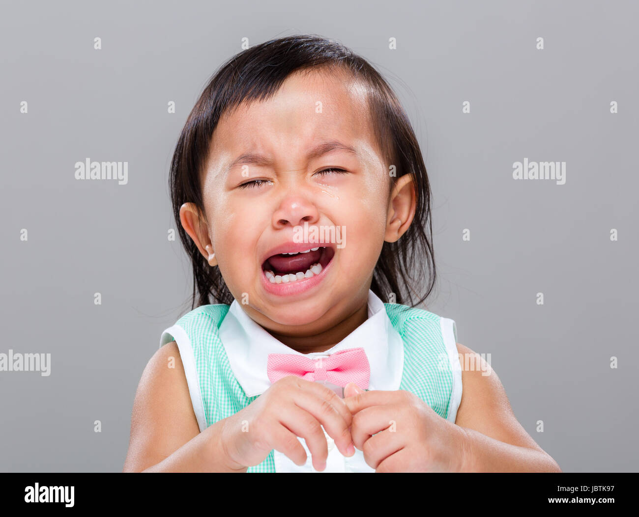 Mixed race baby cry Stock Photo - Alamy