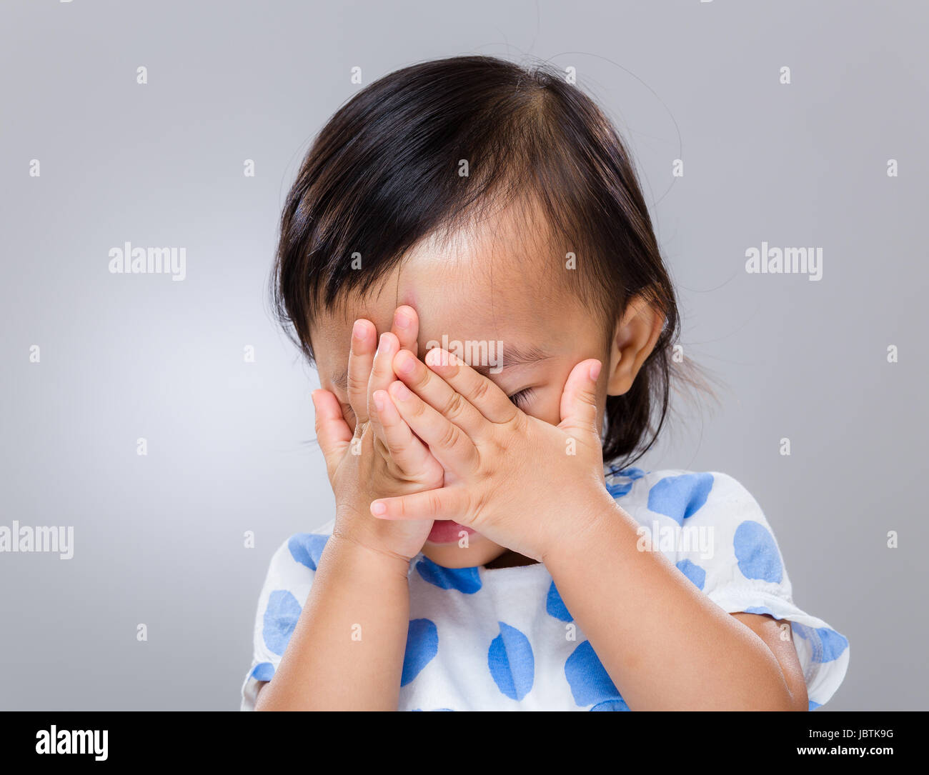 Baby hand cover face hi-res stock photography and images - Alamy