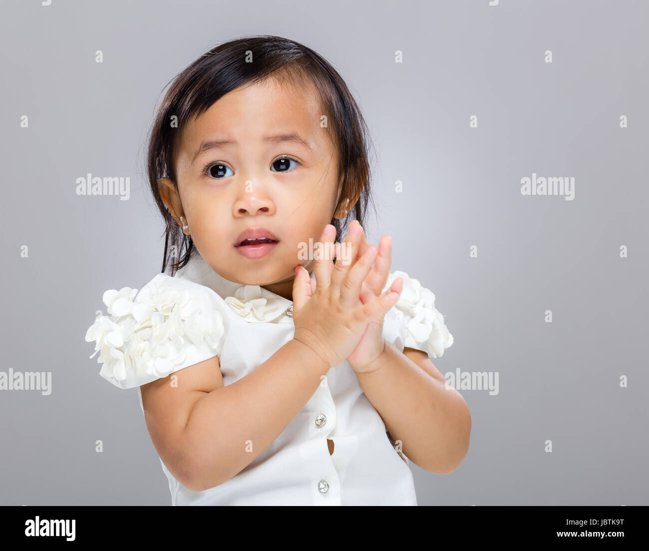 Baby girl clap hand Stock Photo - Alamy