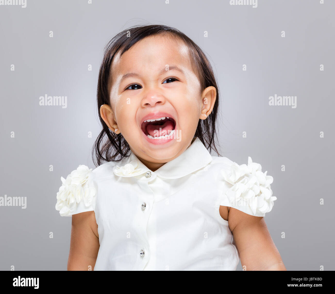 Baby girl scream Stock Photo - Alamy