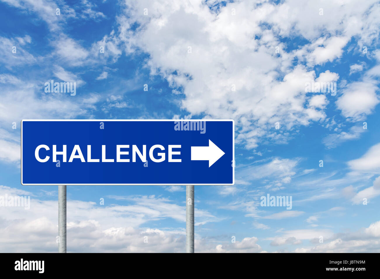 challenge on blue road sign with blue sky Stock Photo - Alamy