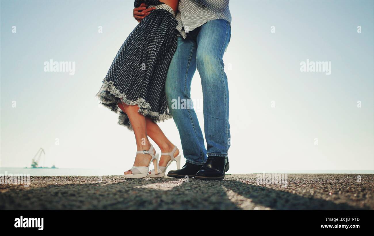 Young couple dancing latin music: Bachata, merengue, salsa. Two elegance pose on sea or ocean ...