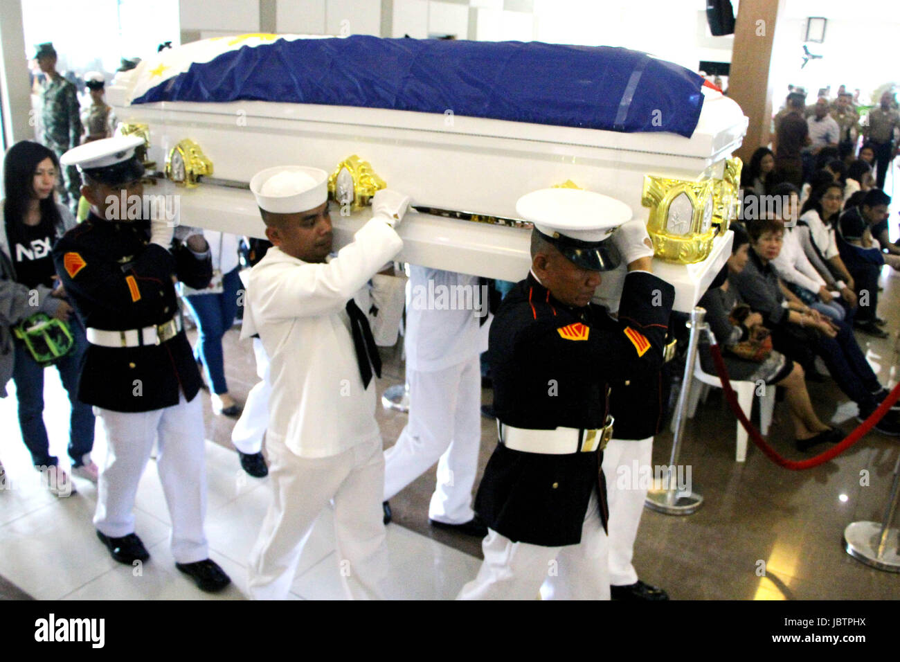 The members of marines and navy carried the remain of their comrades ...