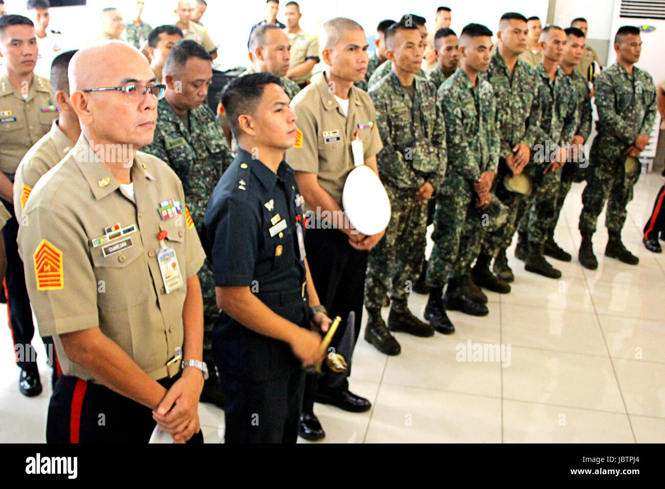 The family, friends and members of marines giving a last salute and ...