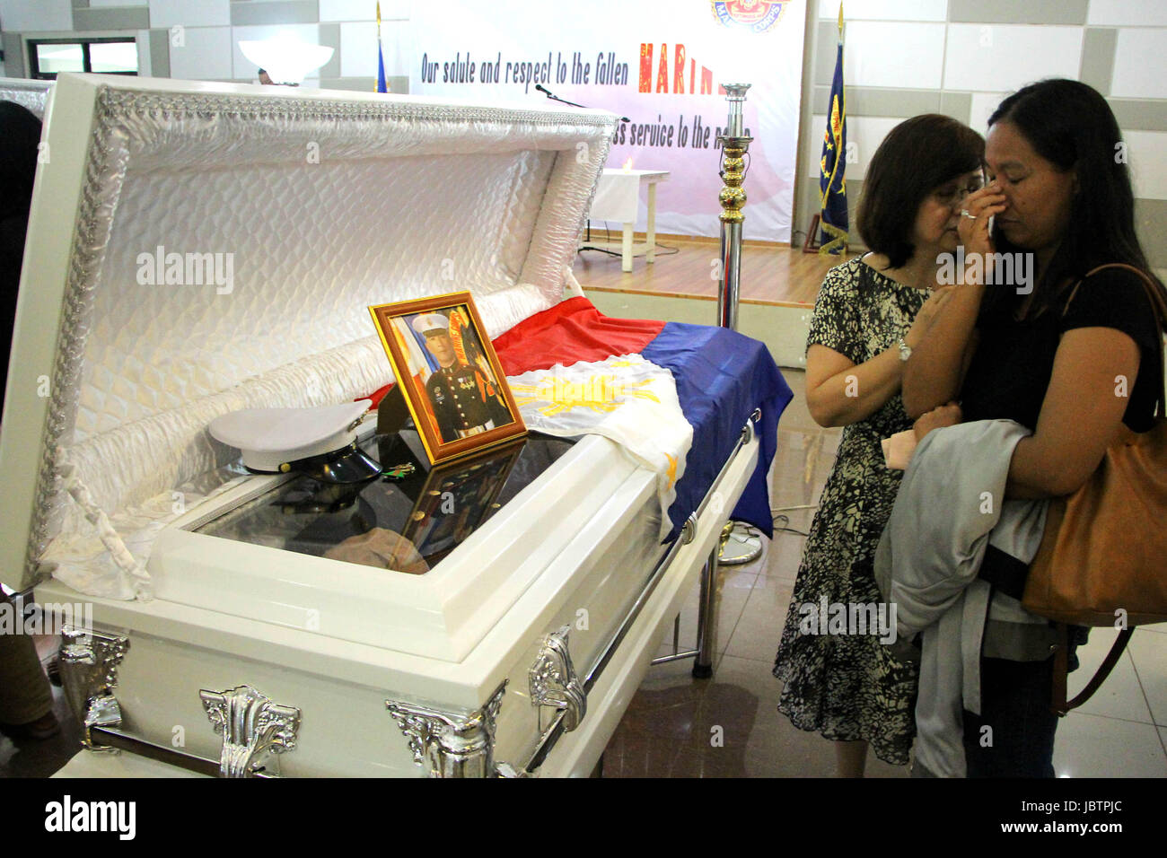 The family of fallen marines grief on the remain of their love once ...