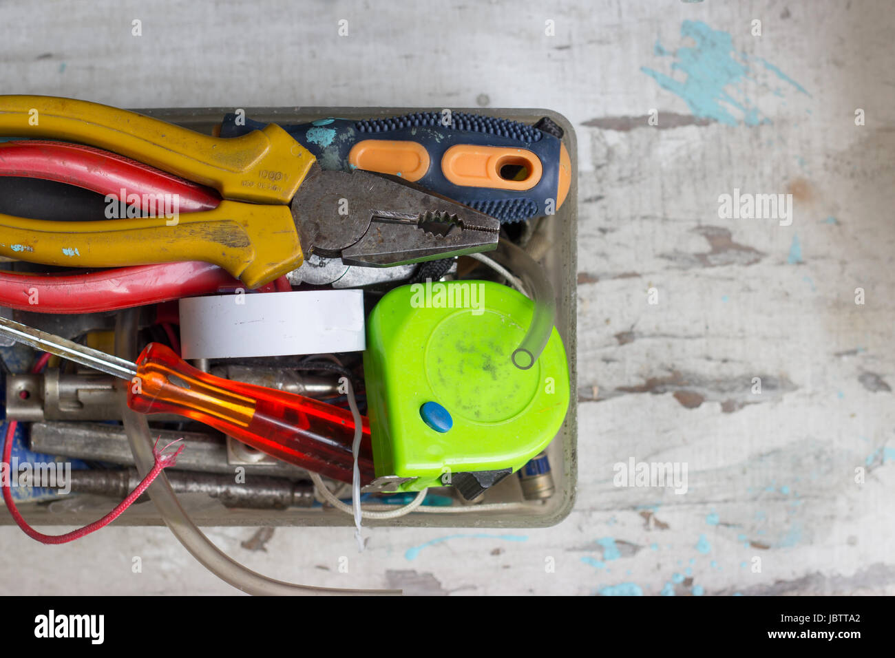 Various tools in the box, on white background Stock Photo - Alamy