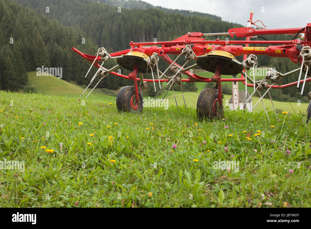 Mechanical tool used by the farmer to move the hay on the meadow ...