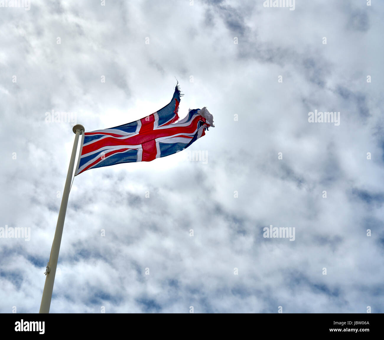 A slightly ragged Union Jack flag flapping in the wind Stock Photo - Alamy