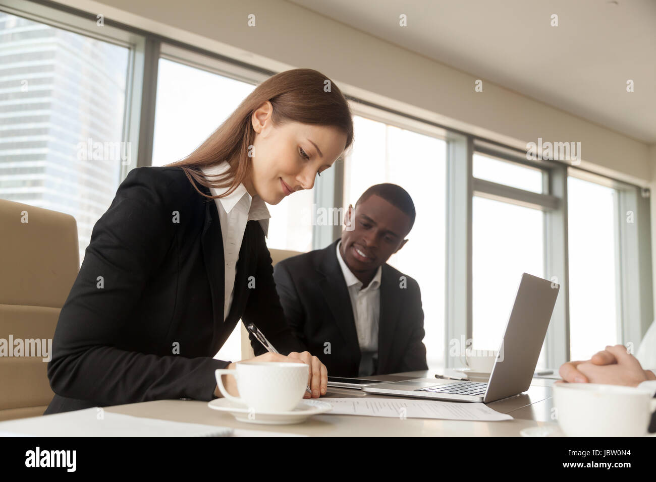 Successful female job applicant signing contract of work, employment ...