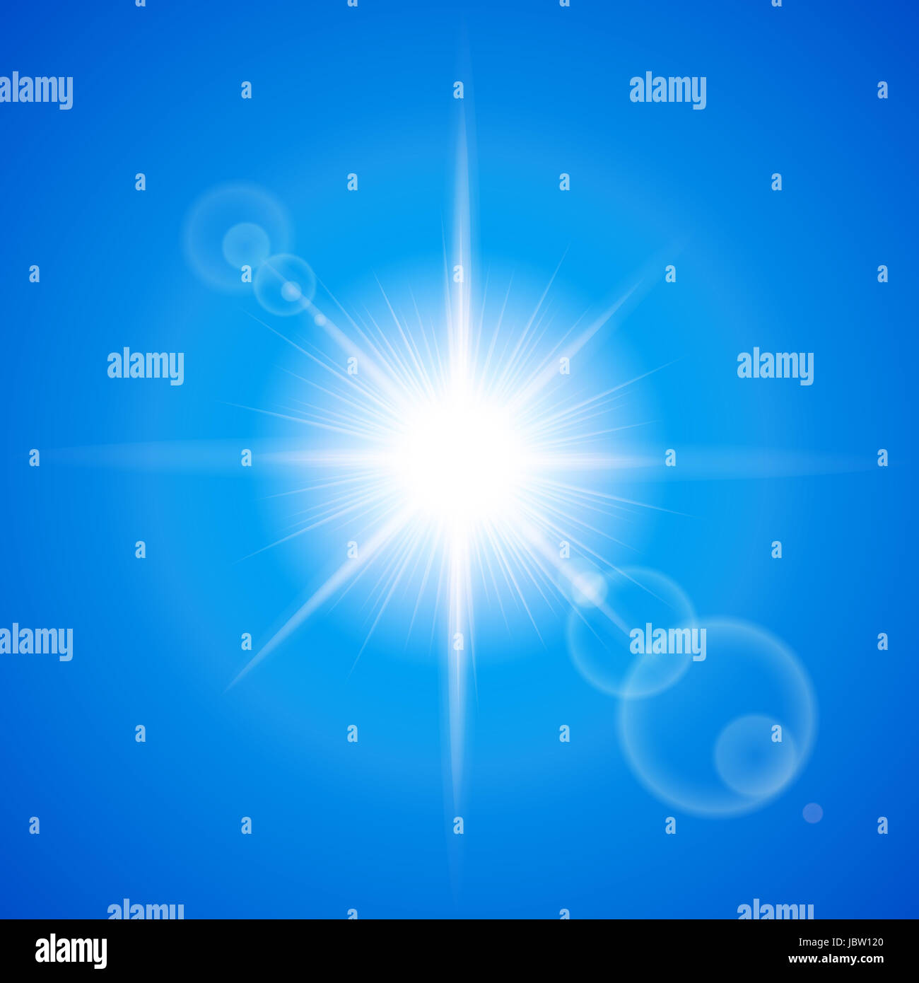 Glaring sun with lens flare over blue background Stock Photo - Alamy