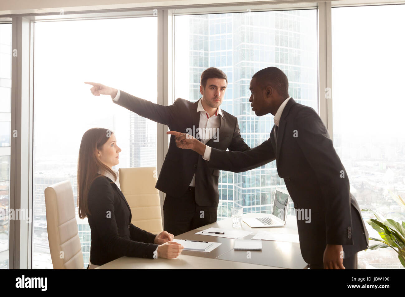 Rude black businessman behaves insultingly impolitely at meeting ...