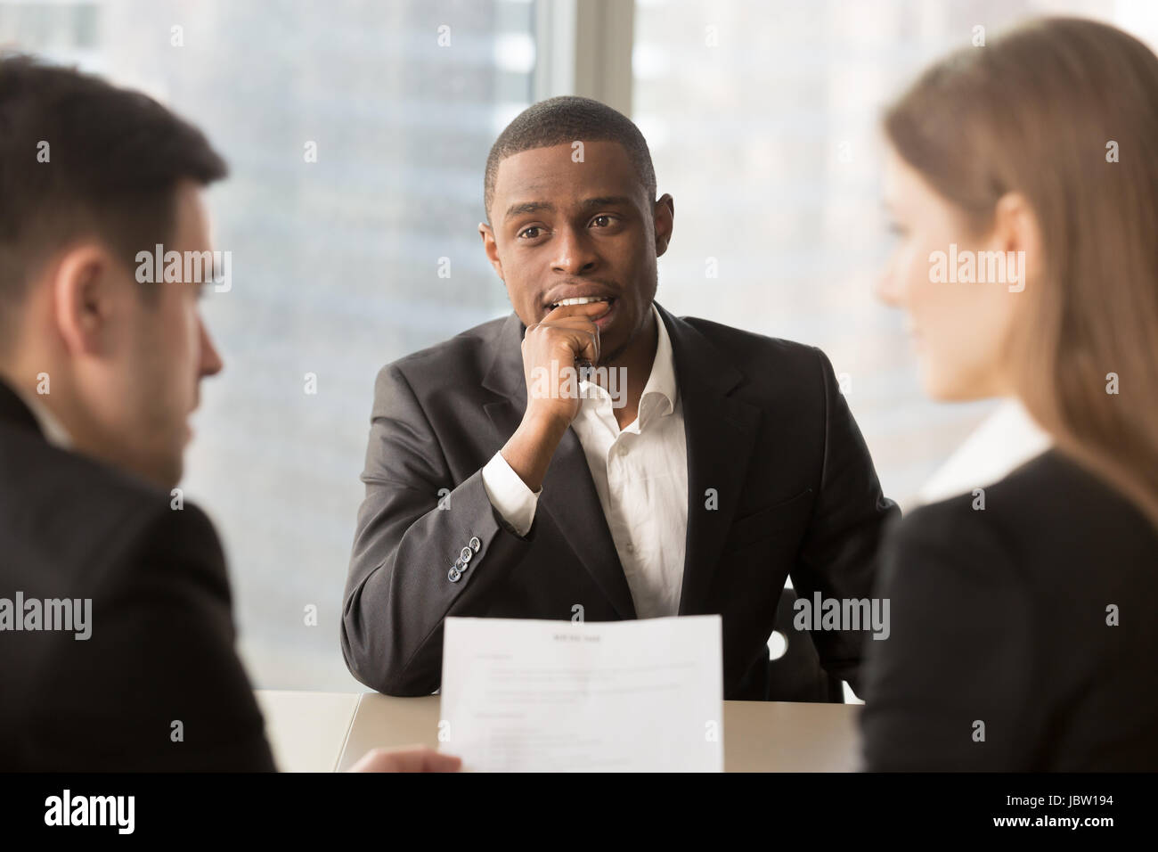Nervous worried unemployed african-american job applicant waiting for ...