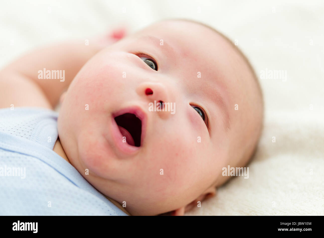 Cute baby boy yelling Stock Photo - Alamy